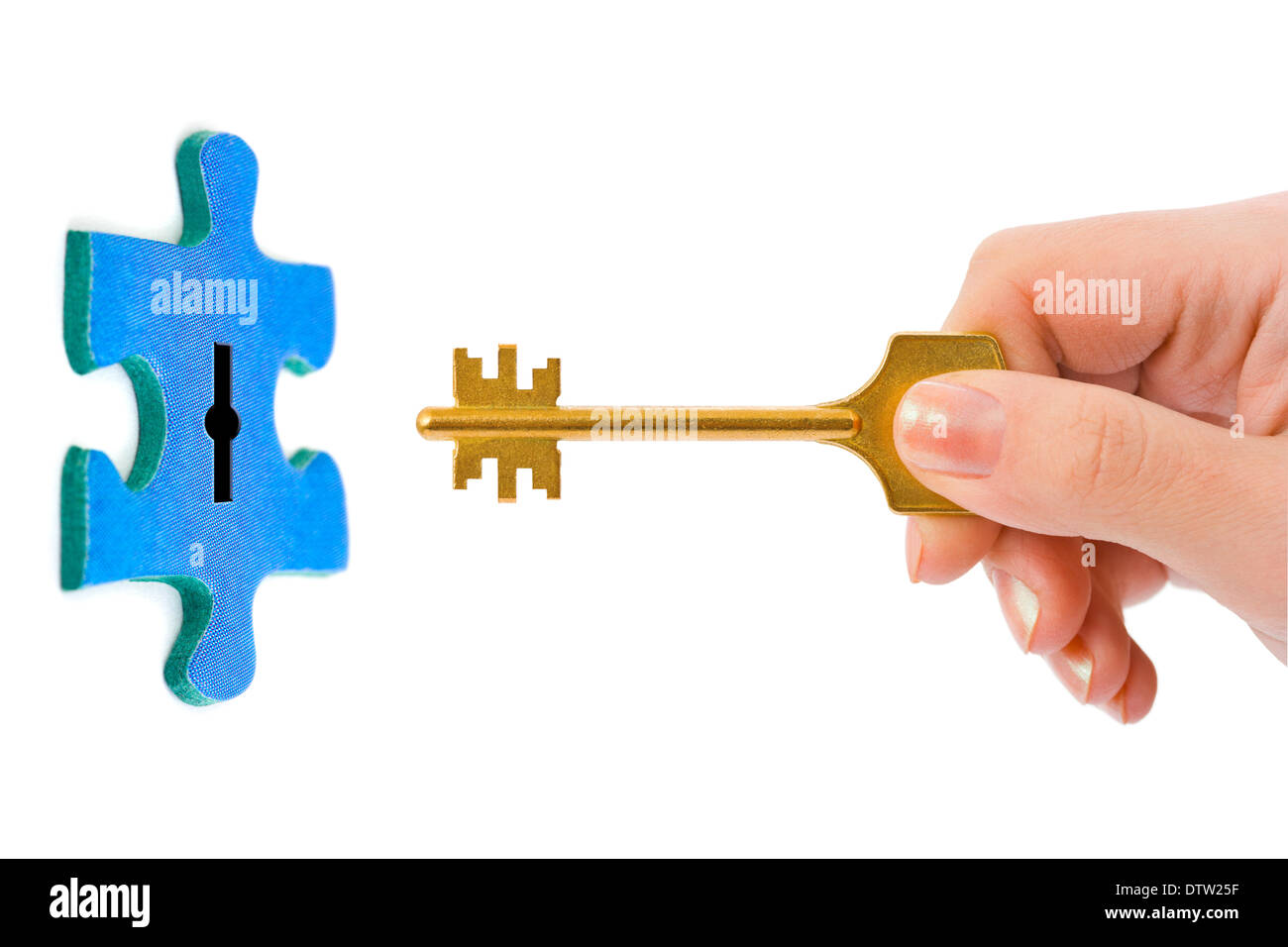 Hand with key and puzzle Stock Photo - Alamy