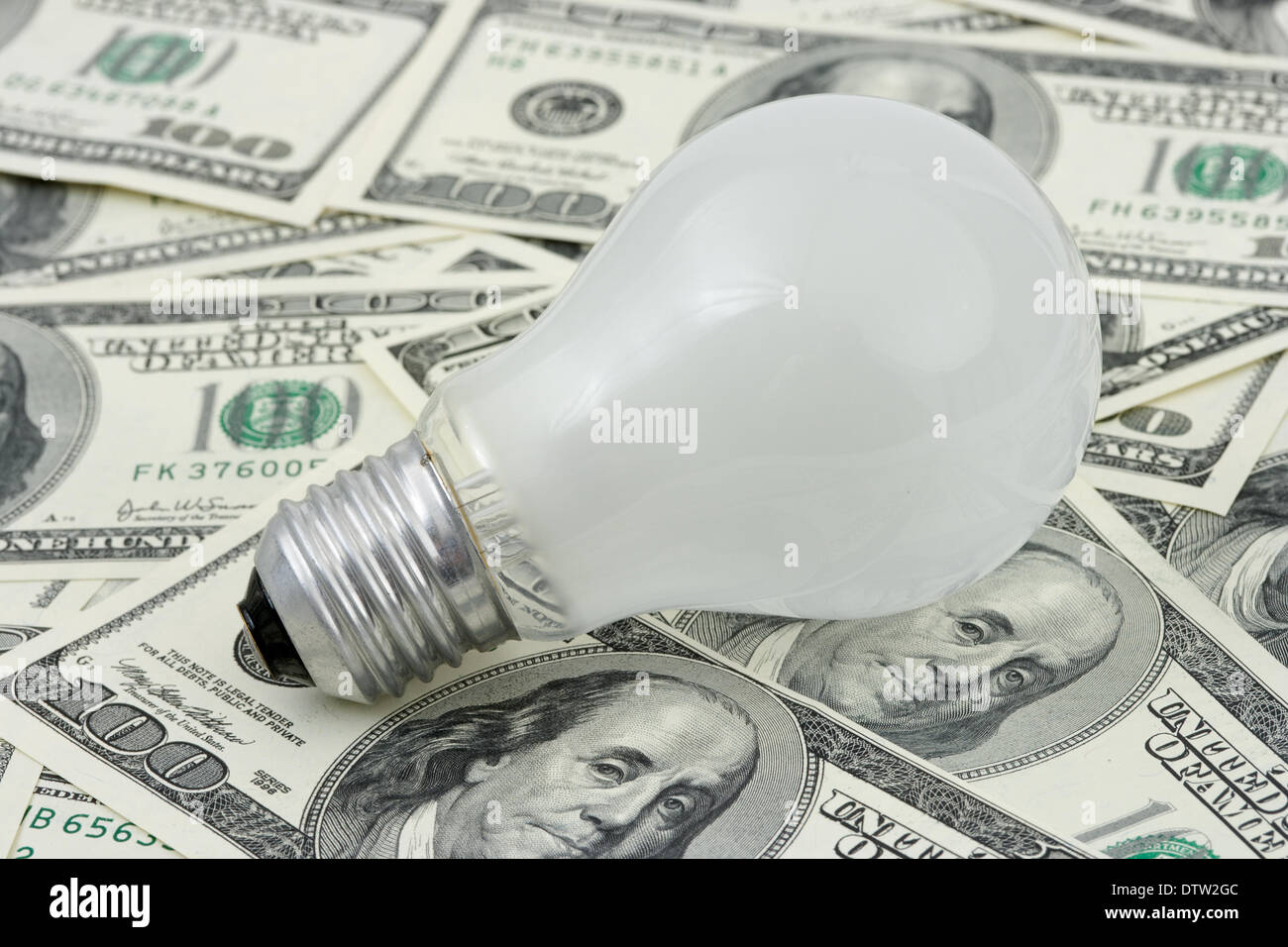 Lamp on money background Stock Photo - Alamy