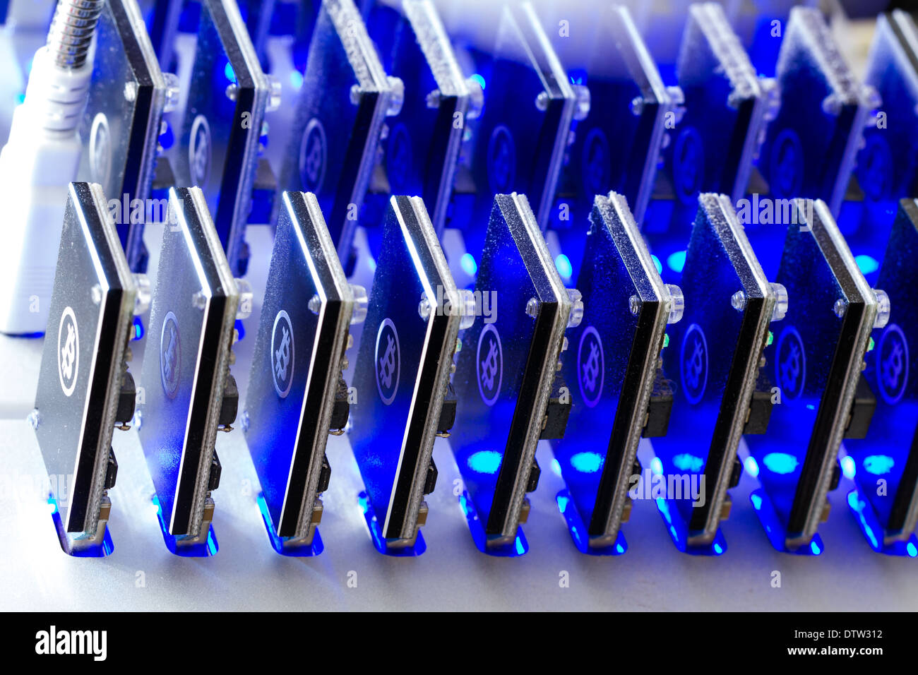 Bitcoin mining USB devices in a row with small fans Stock Photo - Alamy