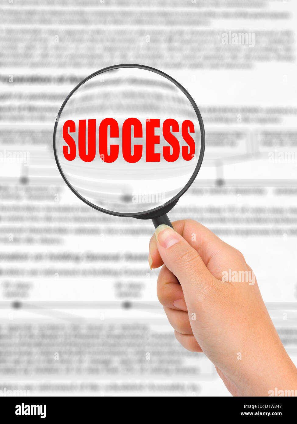 Magnifying glass in hand and word Success Stock Photo - Alamy