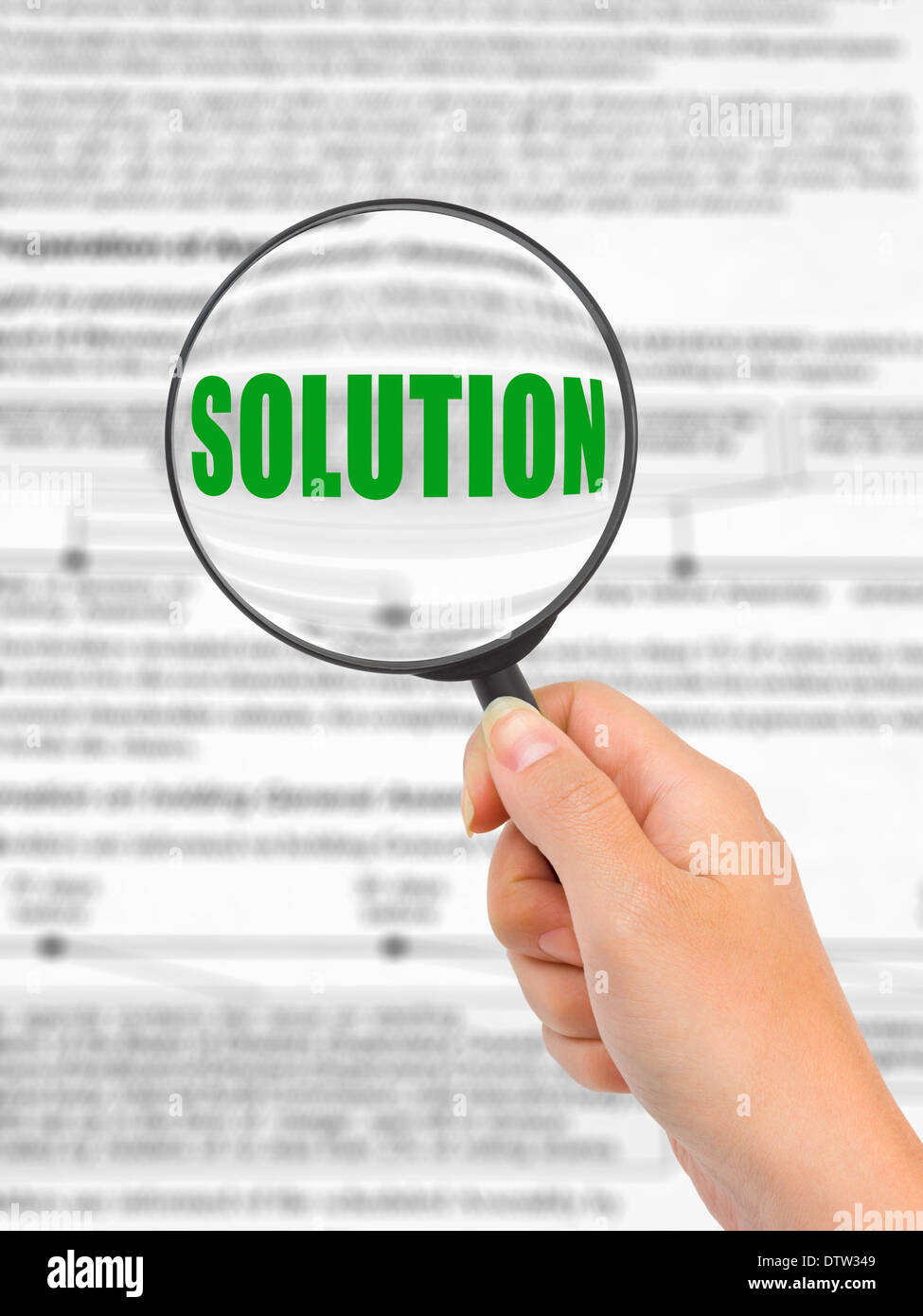 Magnifying glass in hand and word Solution Stock Photo - Alamy