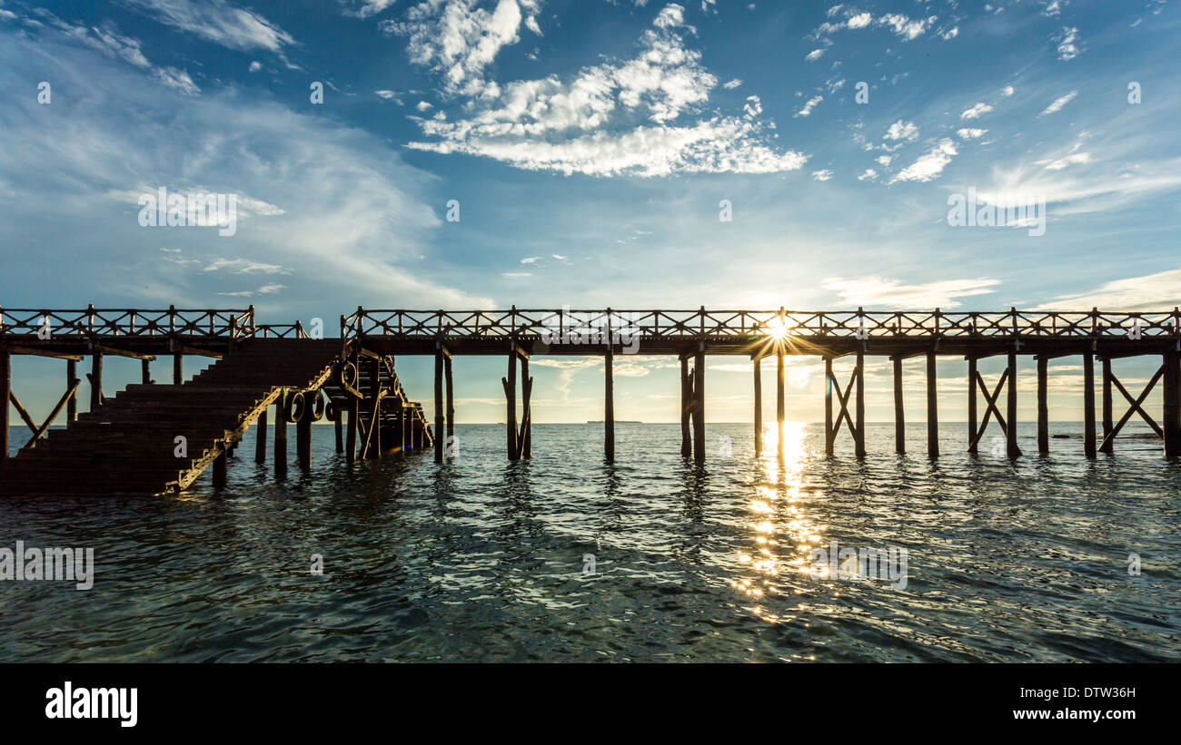 An old wooden bridge built on the shore of Prison Island in Zanzibar ...
