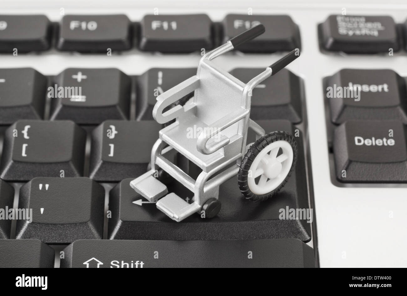 Computer keyboard and wheelchair Stock Photo - Alamy