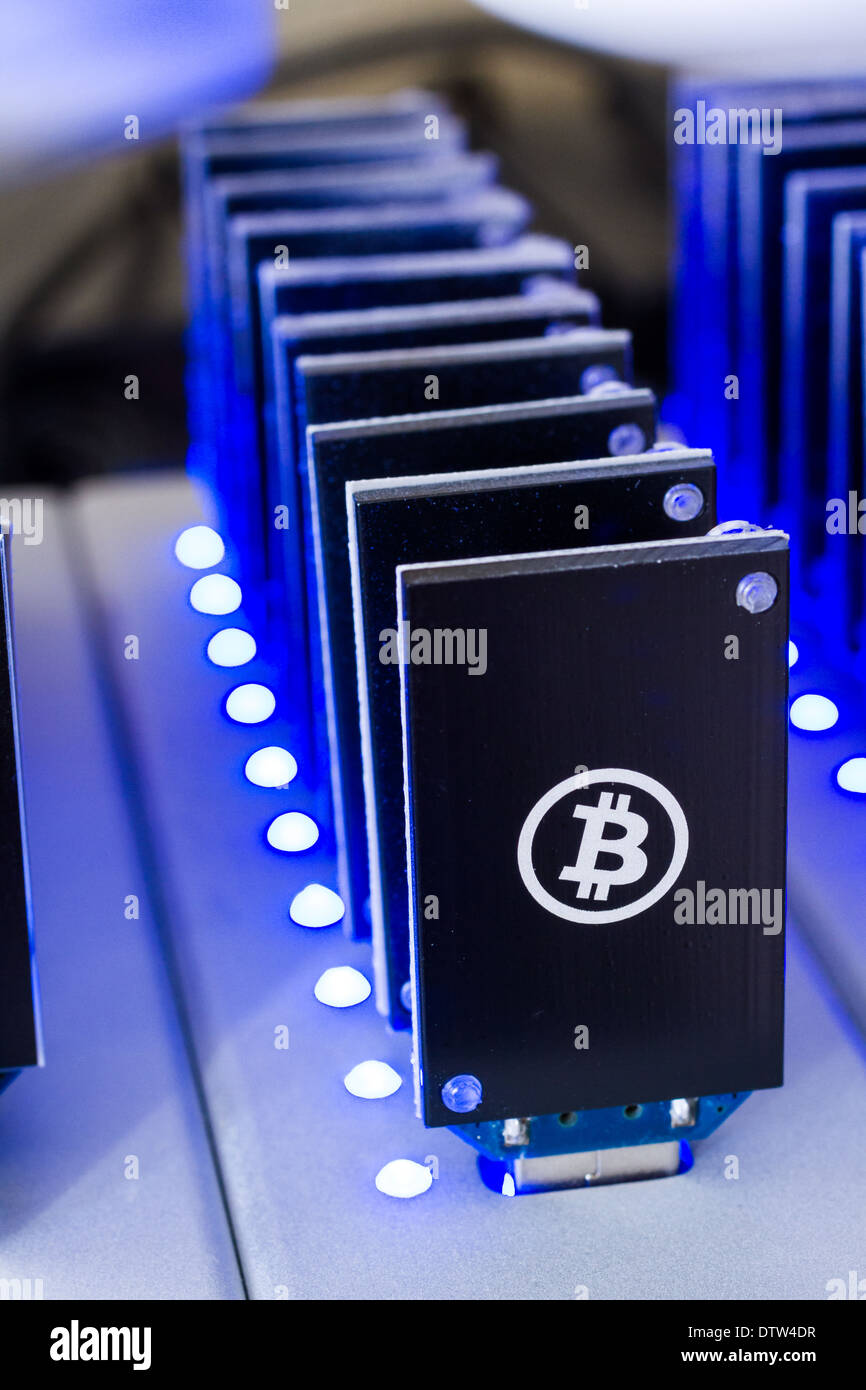 Bitcoin mining USB devices in a row with small fans Stock Photo - Alamy