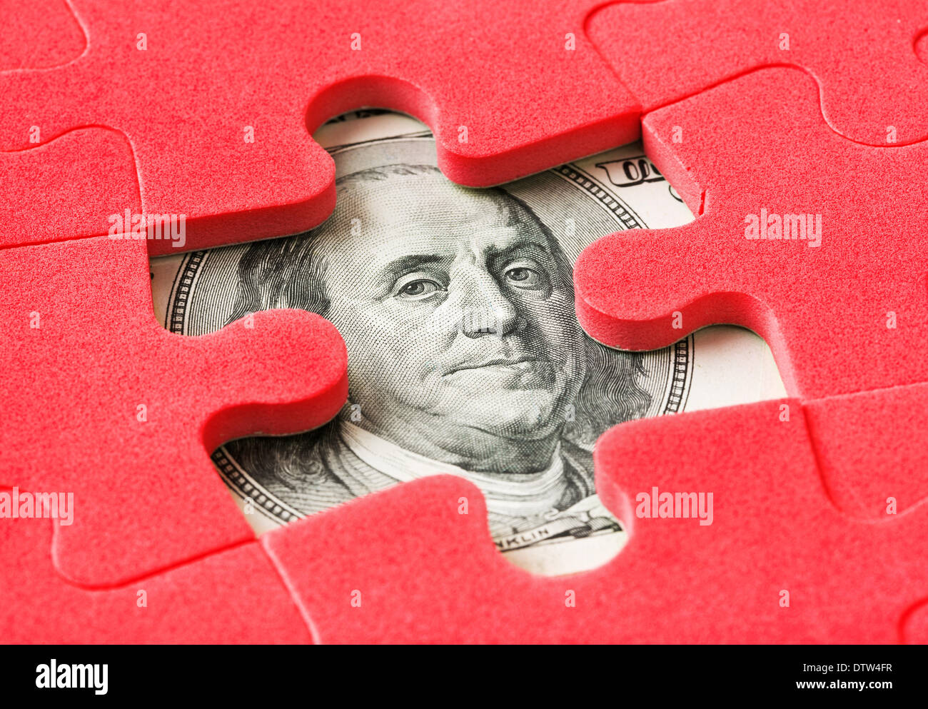 Money and puzzle Stock Photo - Alamy