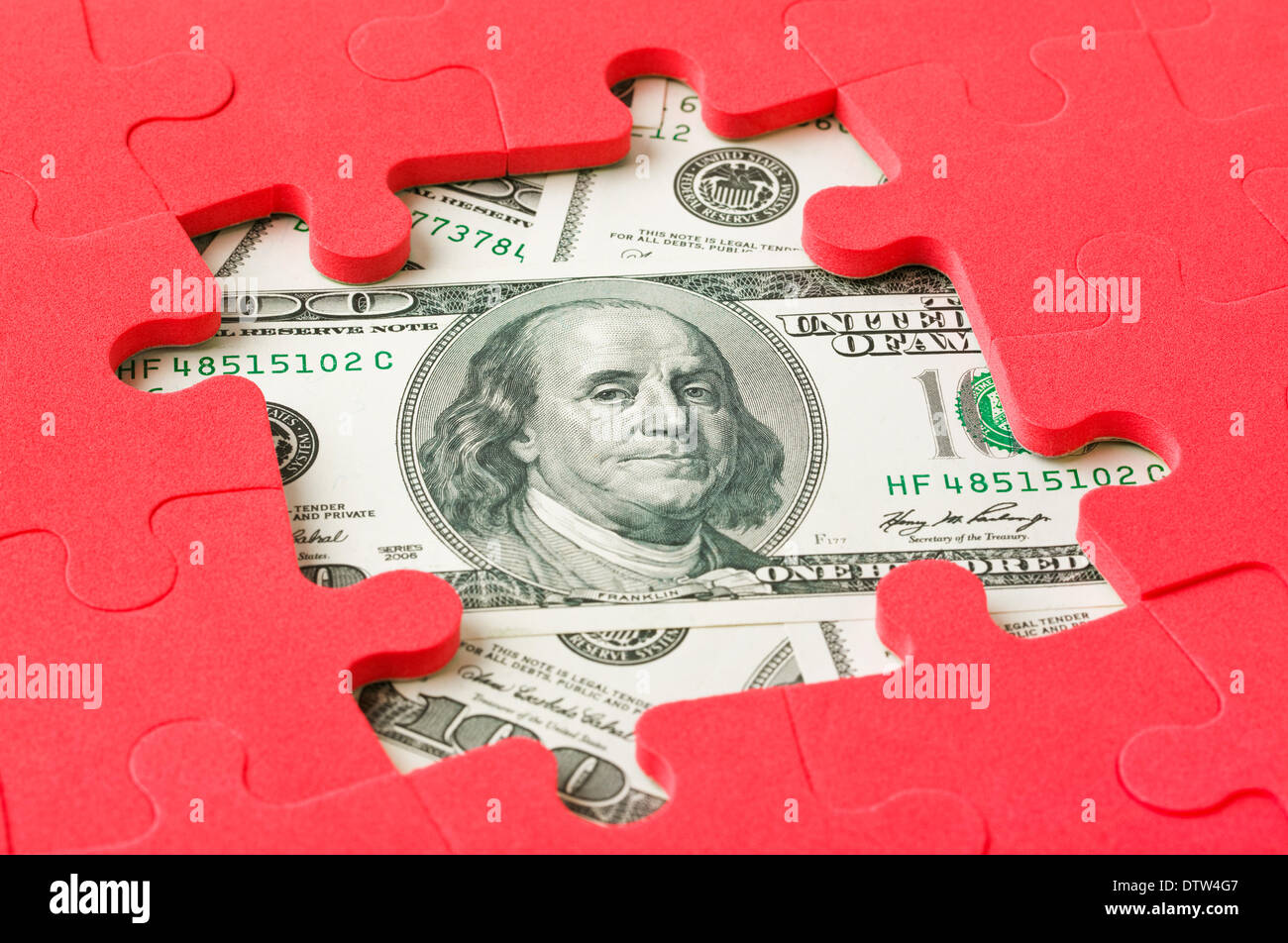 Money and puzzle Stock Photo - Alamy
