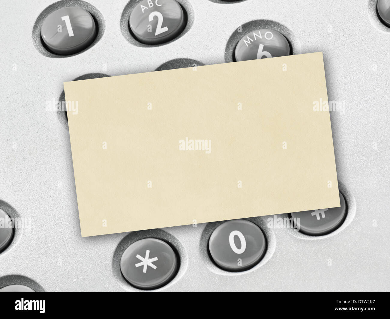 Phone keypad and paper card Stock Photo - Alamy