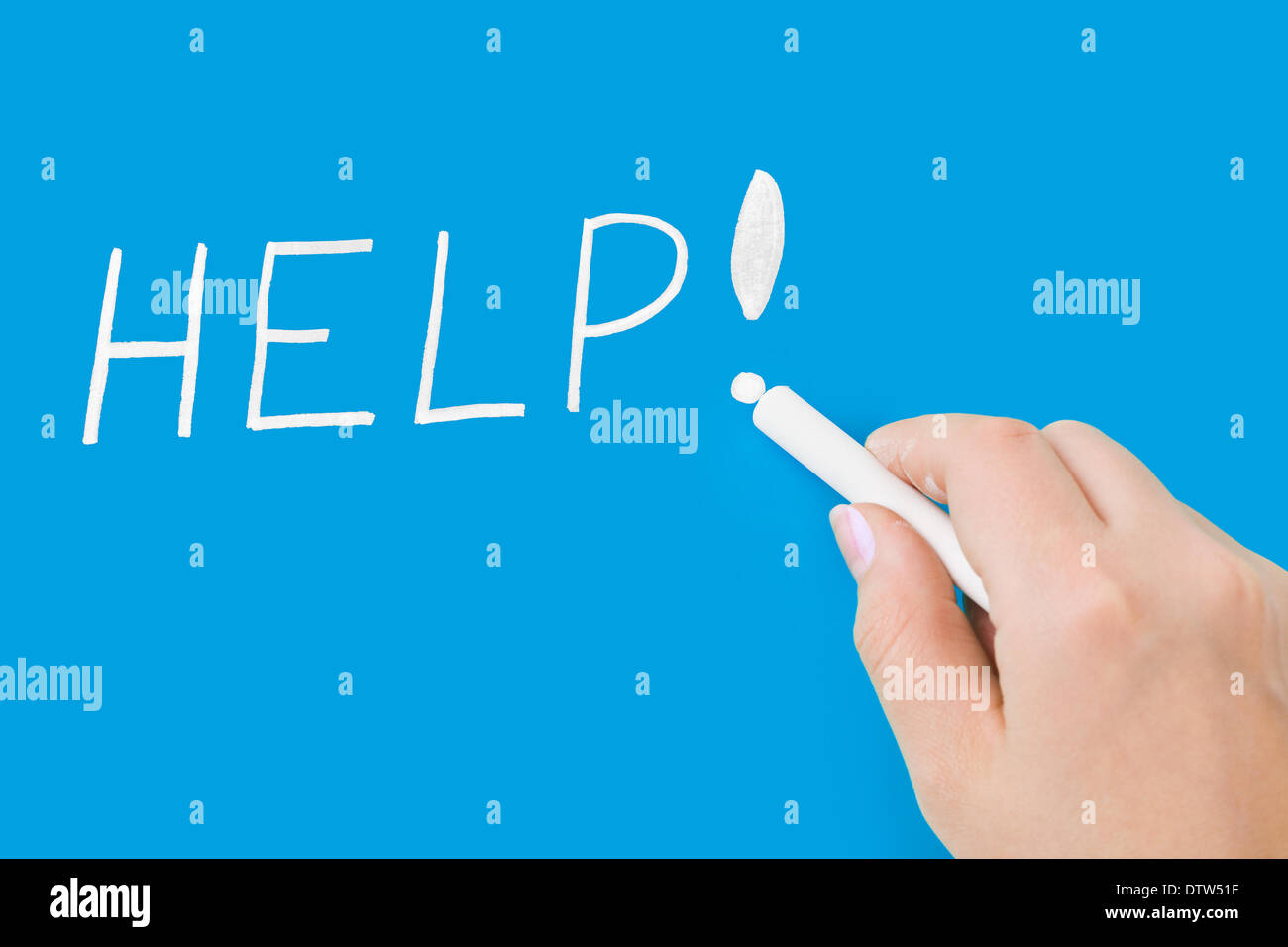 Hand with chalk writing Help Stock Photo - Alamy