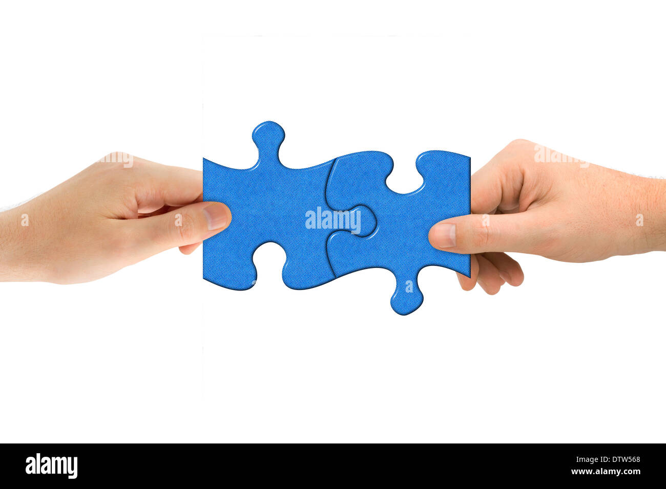 Hands and puzzle Stock Photo - Alamy