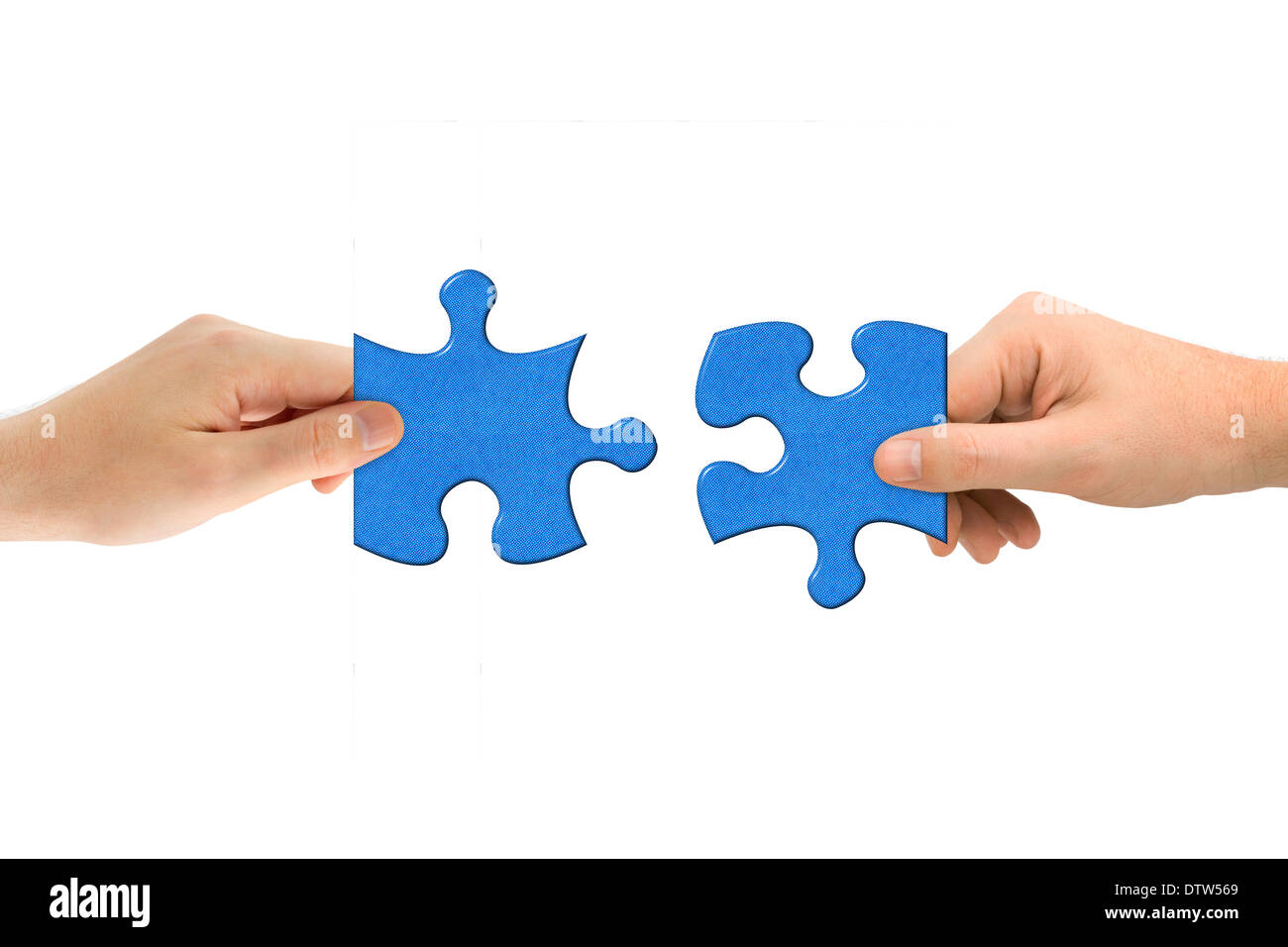 Hands and puzzle Stock Photo - Alamy