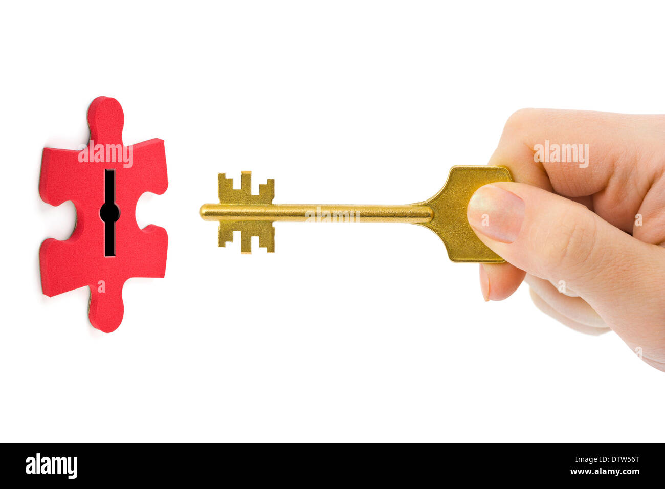 Hand with key and puzzle Stock Photo - Alamy
