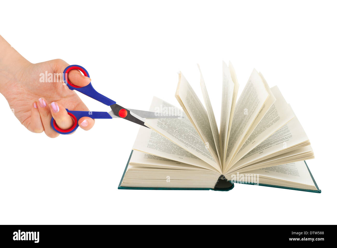 Hand with scissors cutting book Stock Photo - Alamy