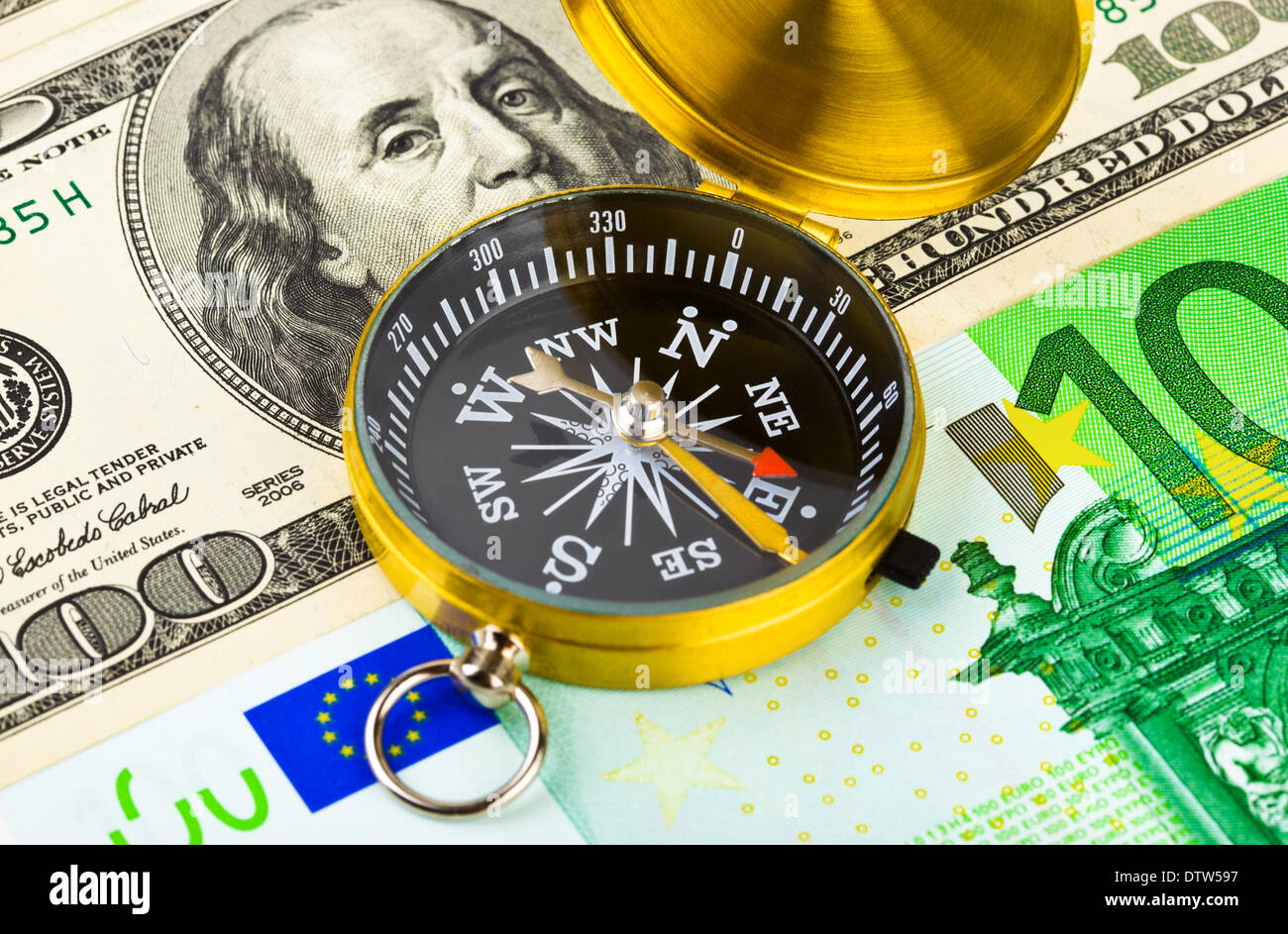 Compass and money Stock Photo - Alamy