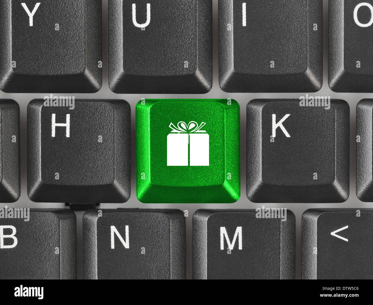 Computer keyboard with gift key Stock Photo - Alamy