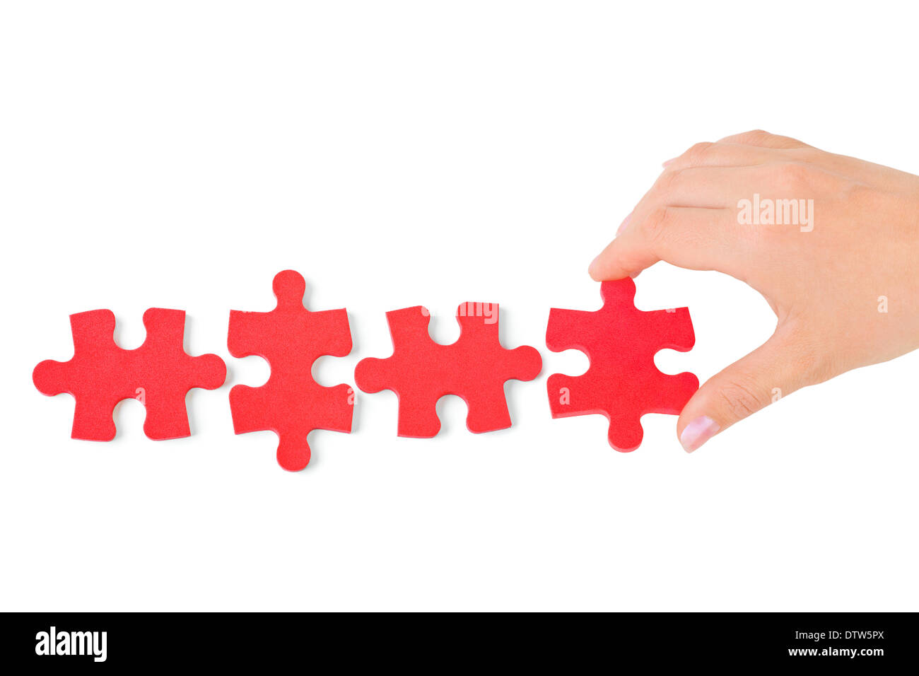 Hand and puzzle Stock Photo - Alamy