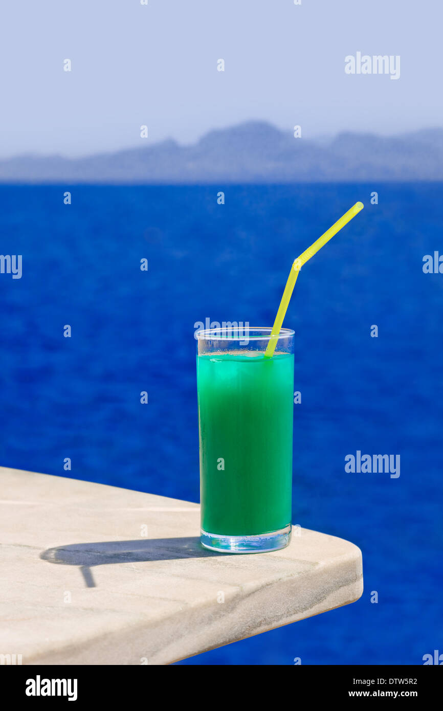Cocktail on marble table at beach Stock Photo - Alamy
