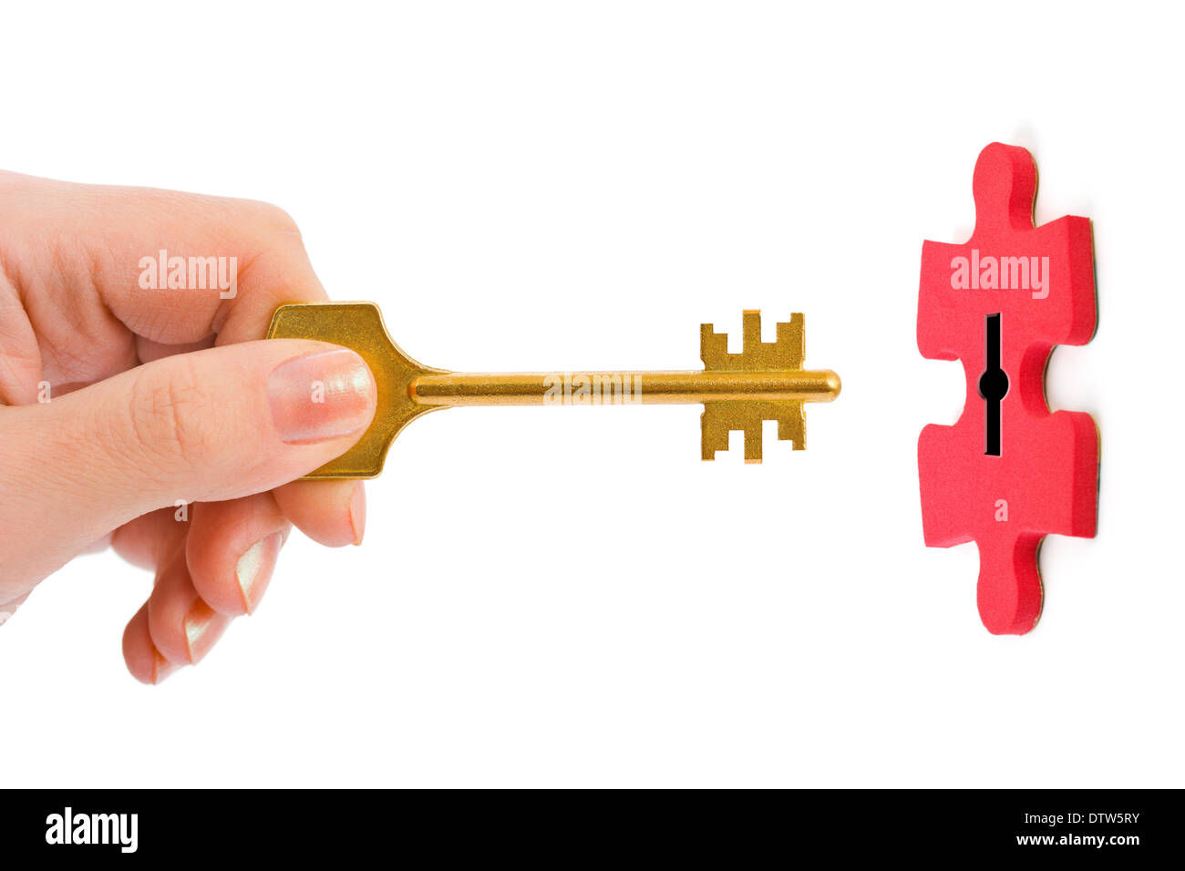 Hand with key and puzzle Stock Photo - Alamy