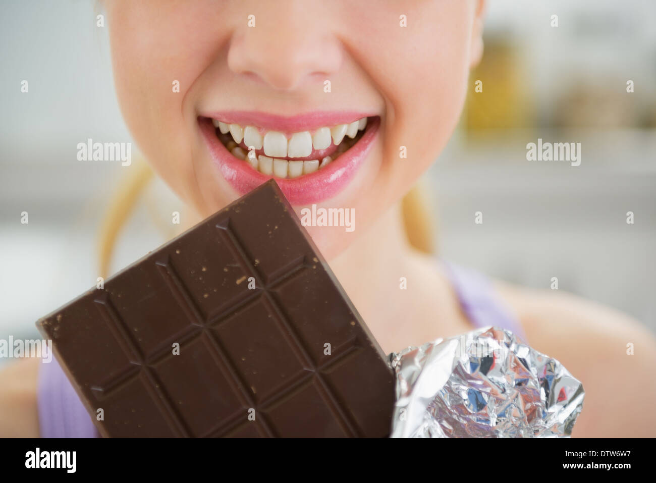 Woman eating dark chocolate hi-res stock photography and images - Alamy