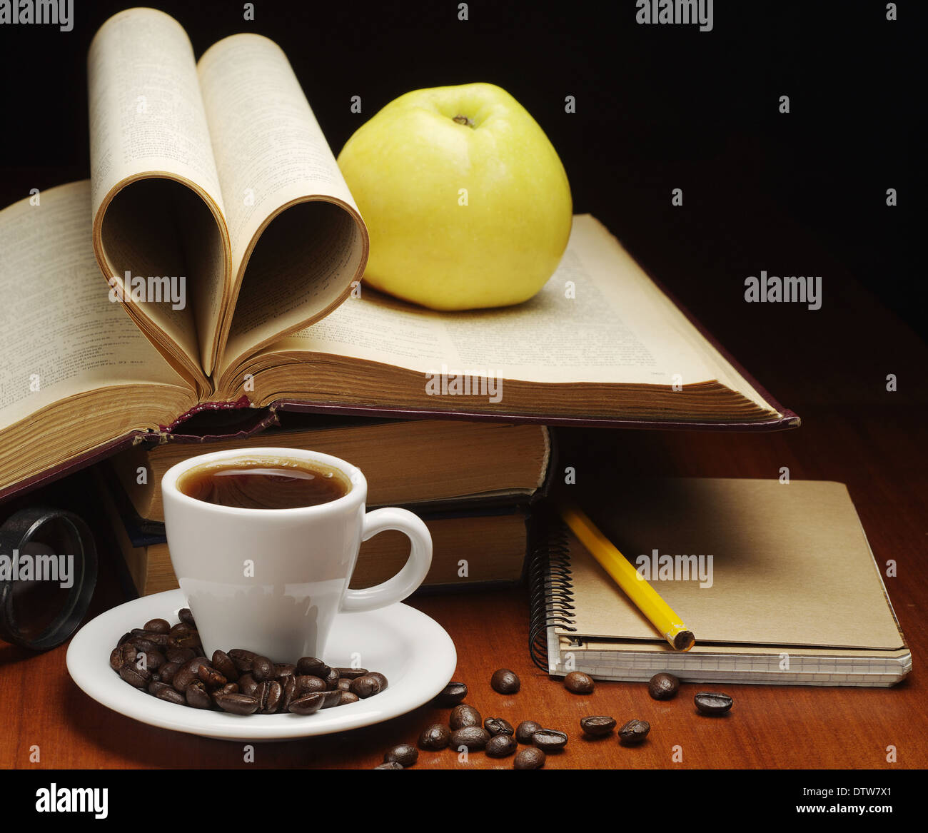 Cup of coffee, notepad, apple and opened book Stock Photo - Alamy