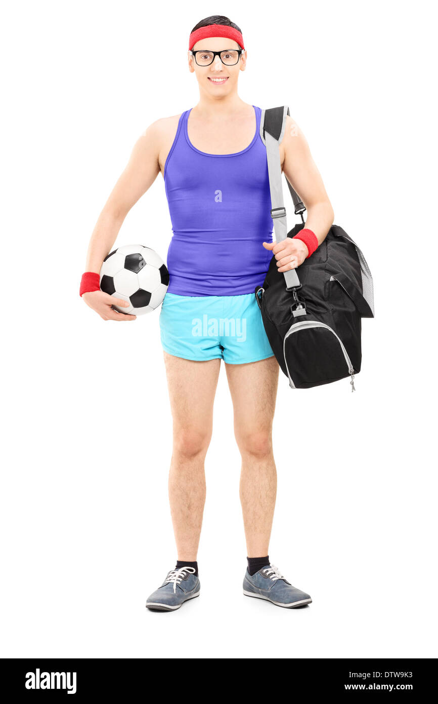 Male athlete with sports bag holding a football Stock Photo - Alamy