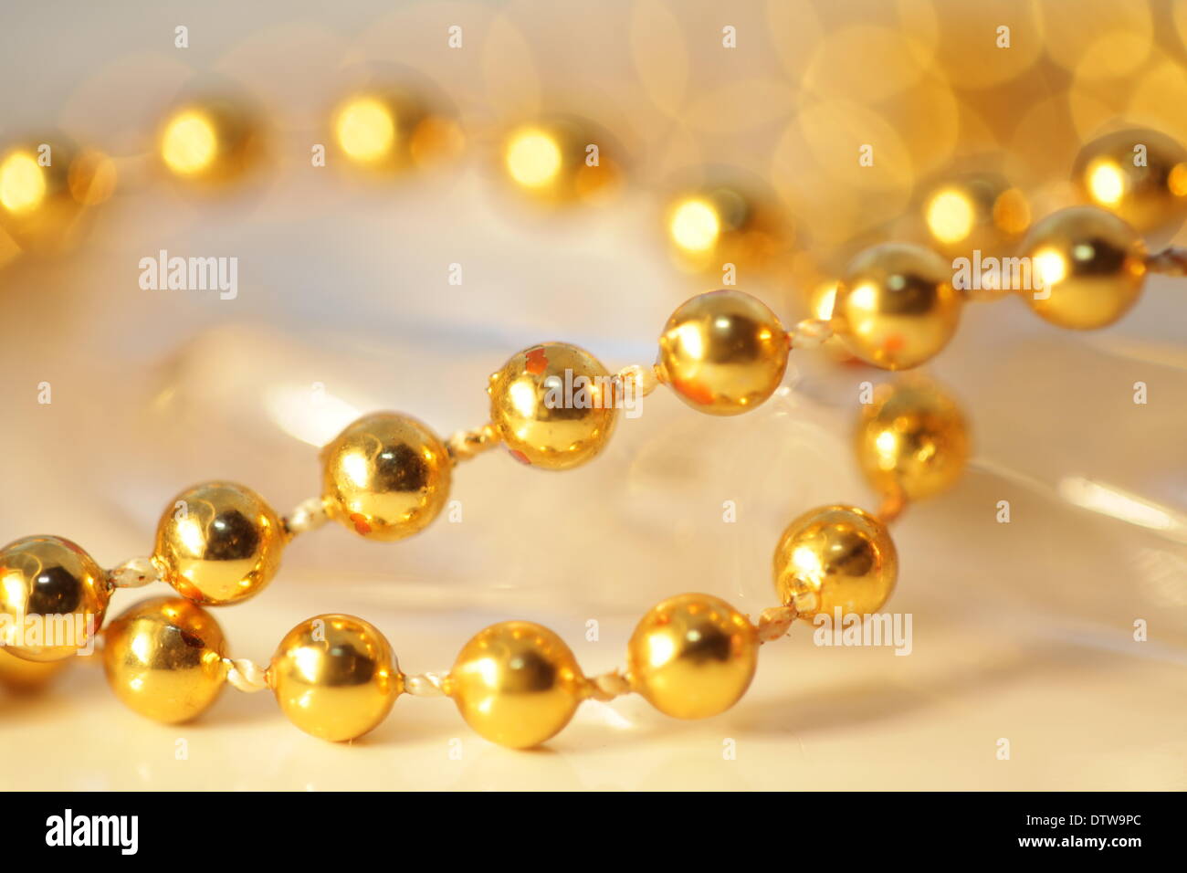 Round gold beads hi-res stock photography and images - Alamy