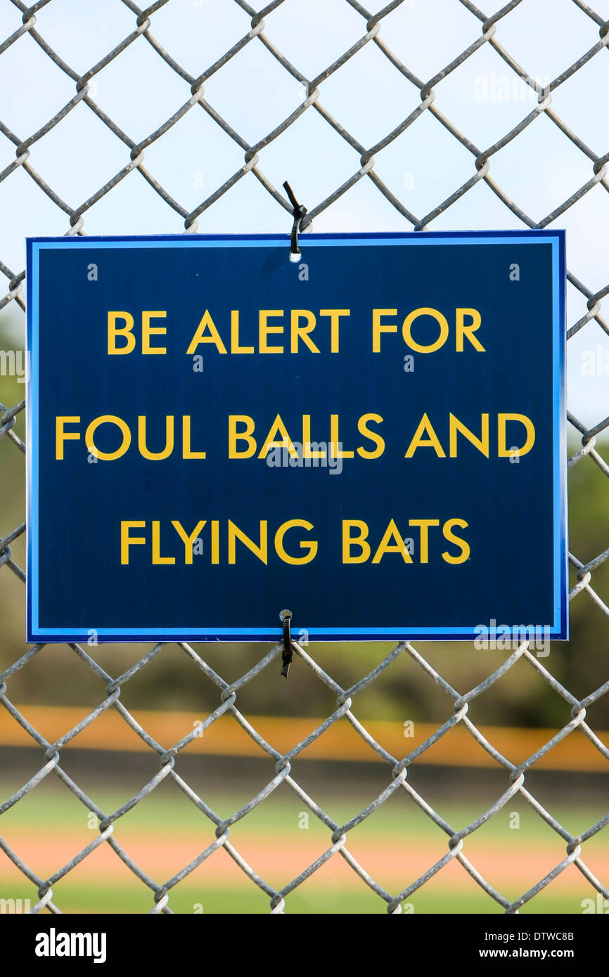 Sign: Be Alert for Foul Balls and Flying Bats Stock Photo - Alamy