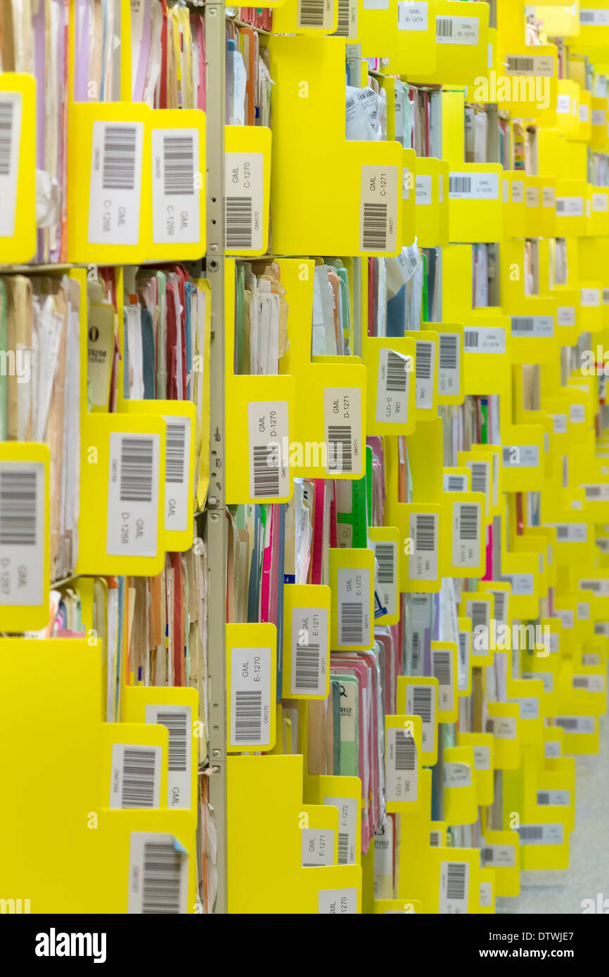 Rows of paper files containing patient records Stock Photo - Alamy