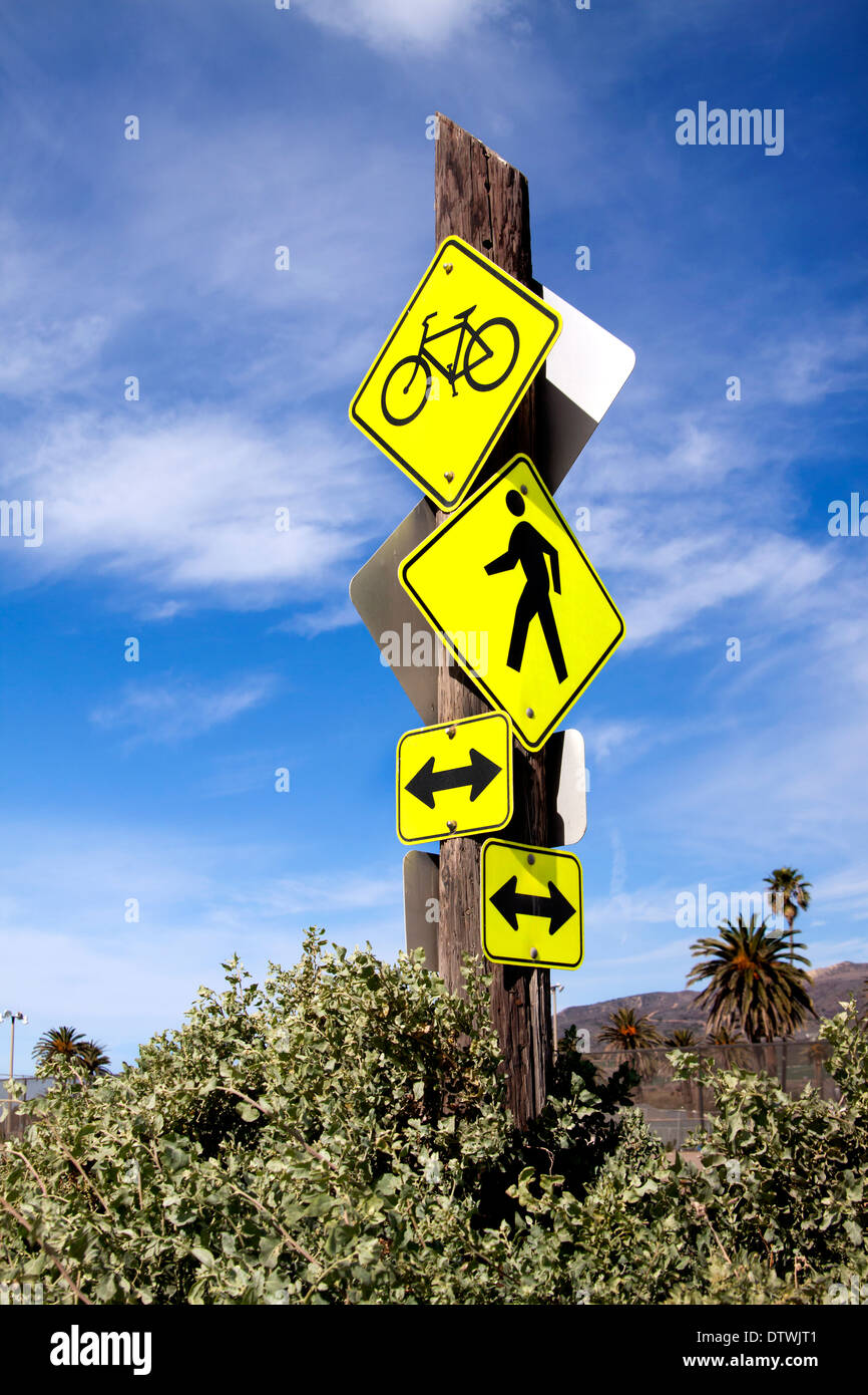 Pedestrian walkway sign against a blue sky Stock Photo - Alamy