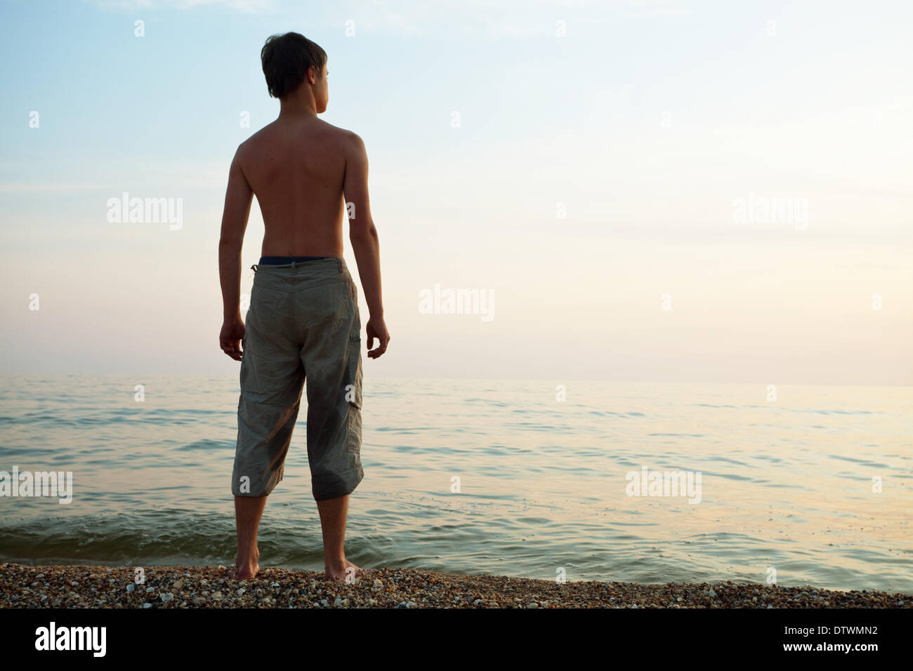 Boy on beach Stock Photo - Alamy