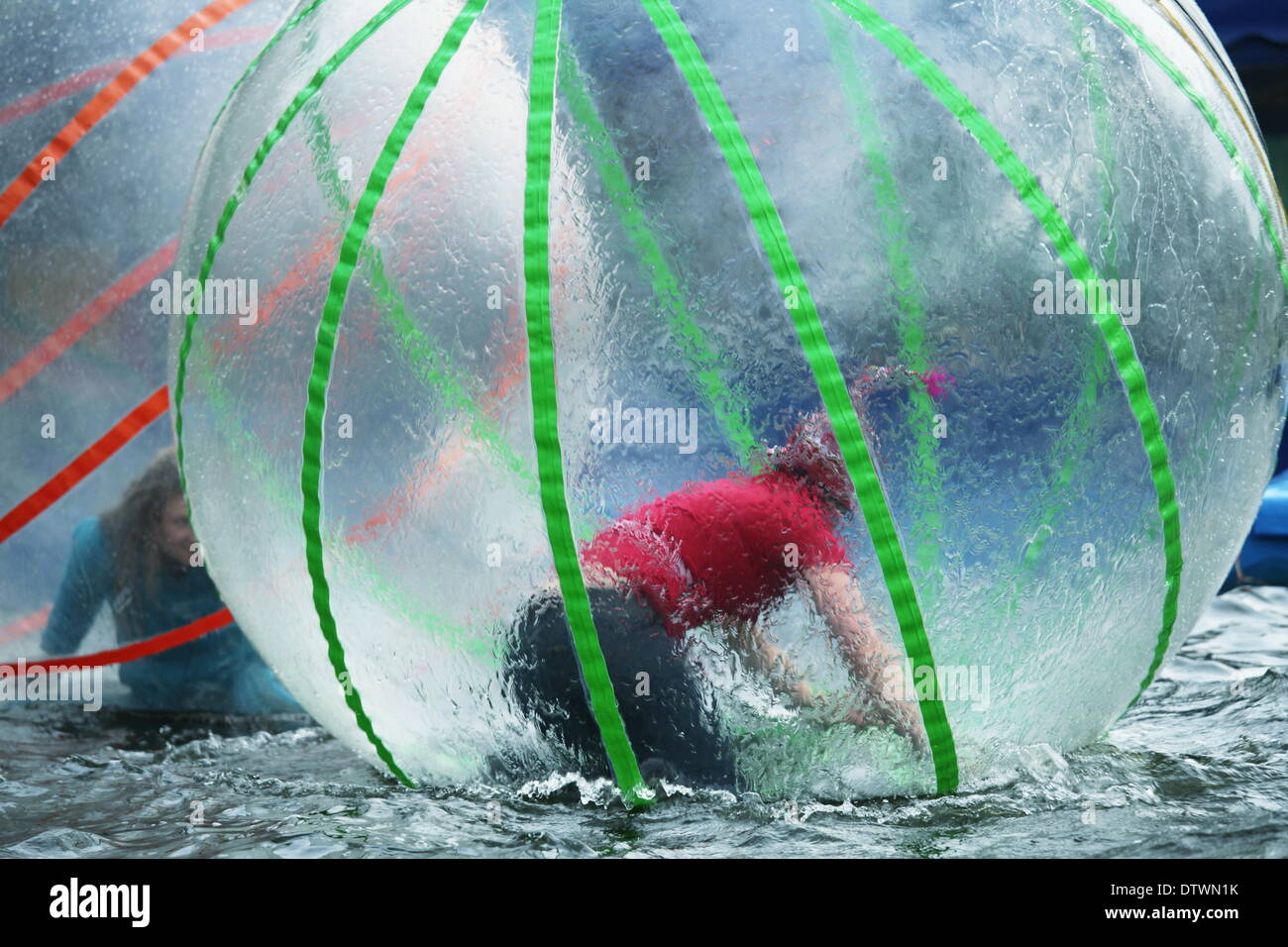 Girl inside zorbing ball hi-res stock photography and images - Alamy