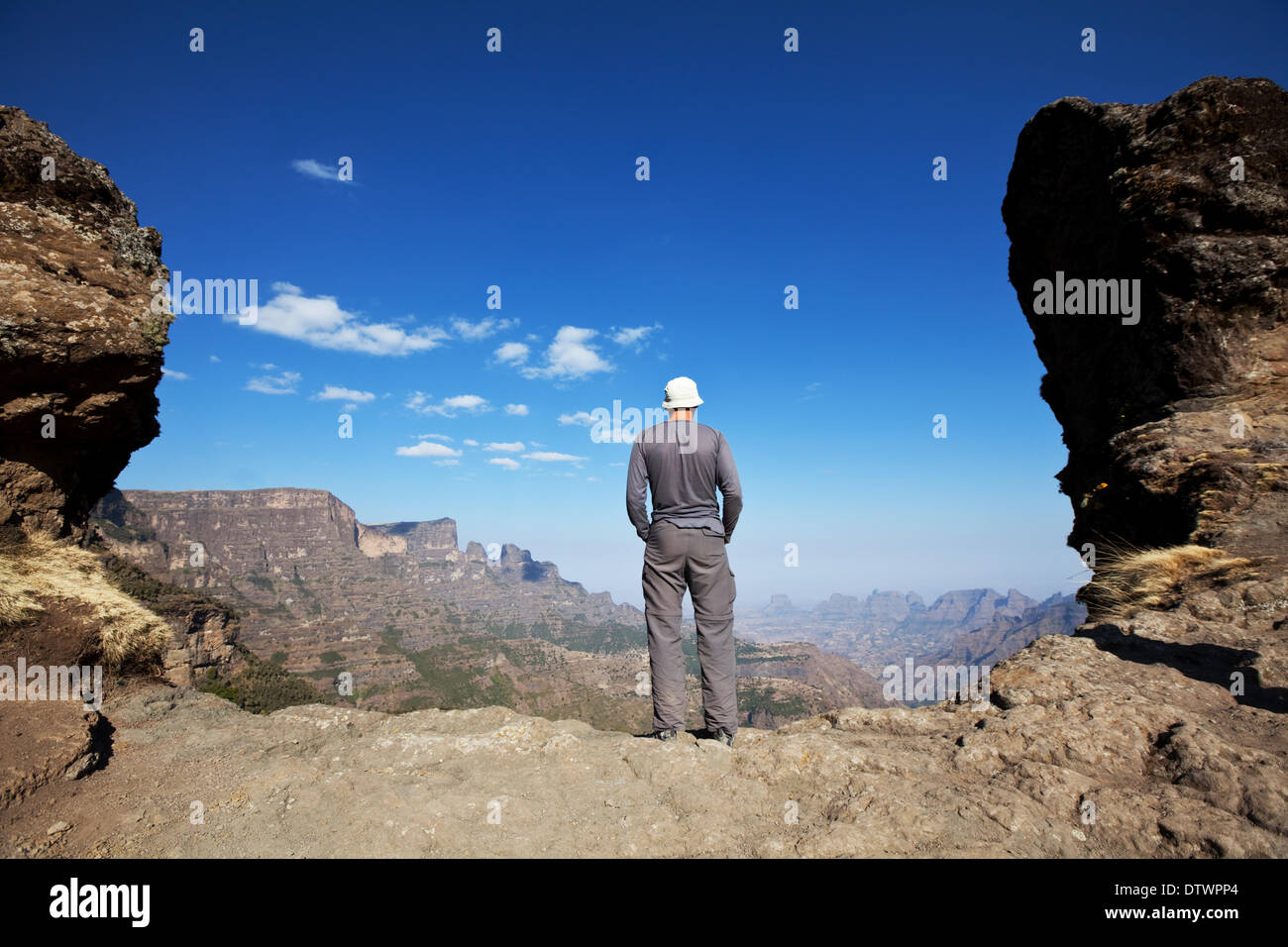 Man on the cliff Stock Photo - Alamy