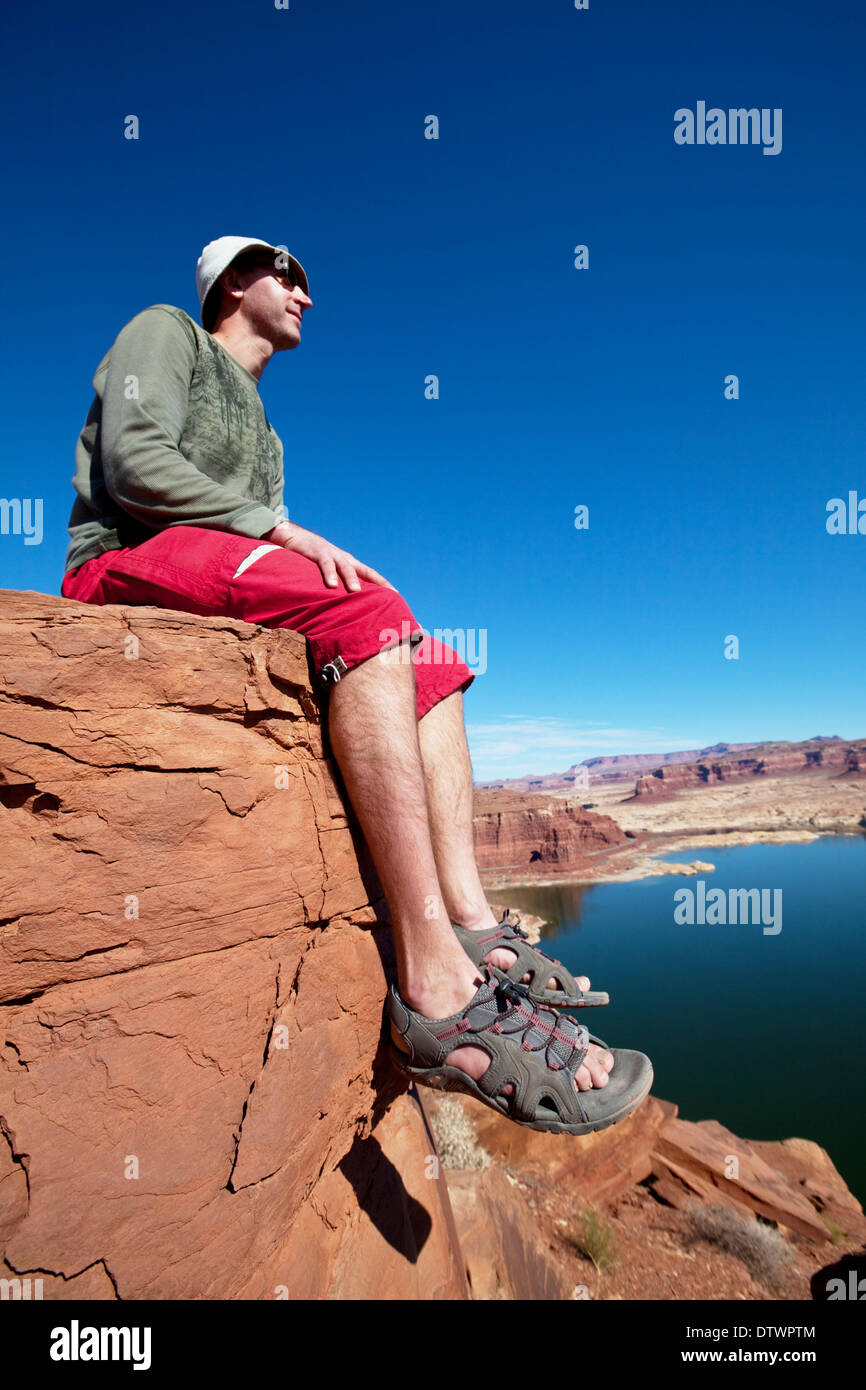Man on the cliff Stock Photo - Alamy