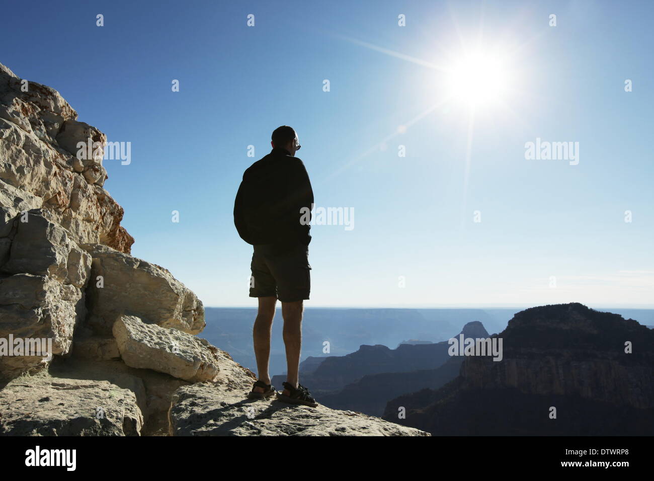 Man on the cliff Stock Photo - Alamy
