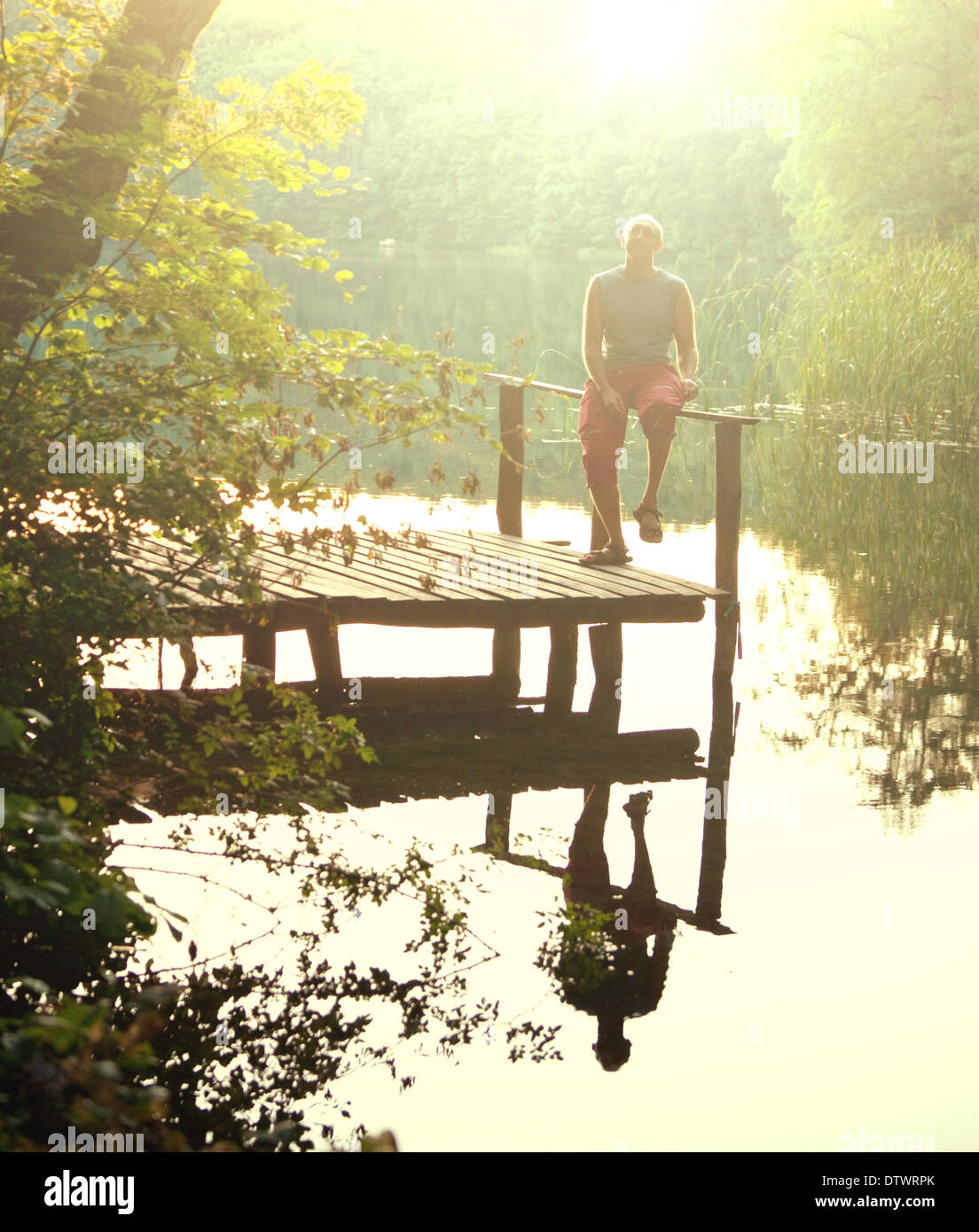 Man on the lake Stock Photo - Alamy