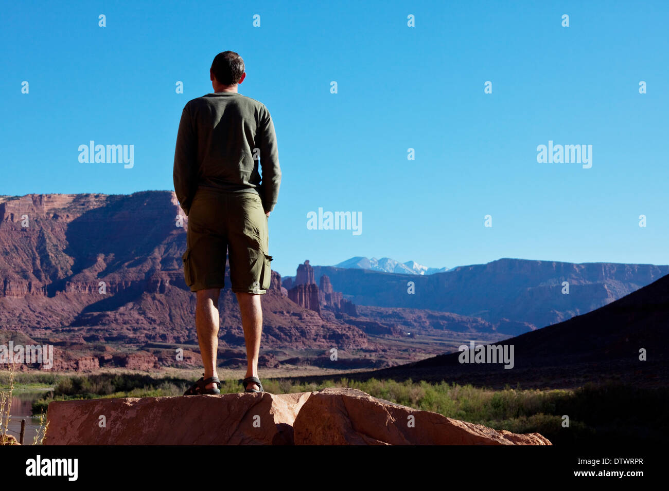 Man on the cliff Stock Photo - Alamy