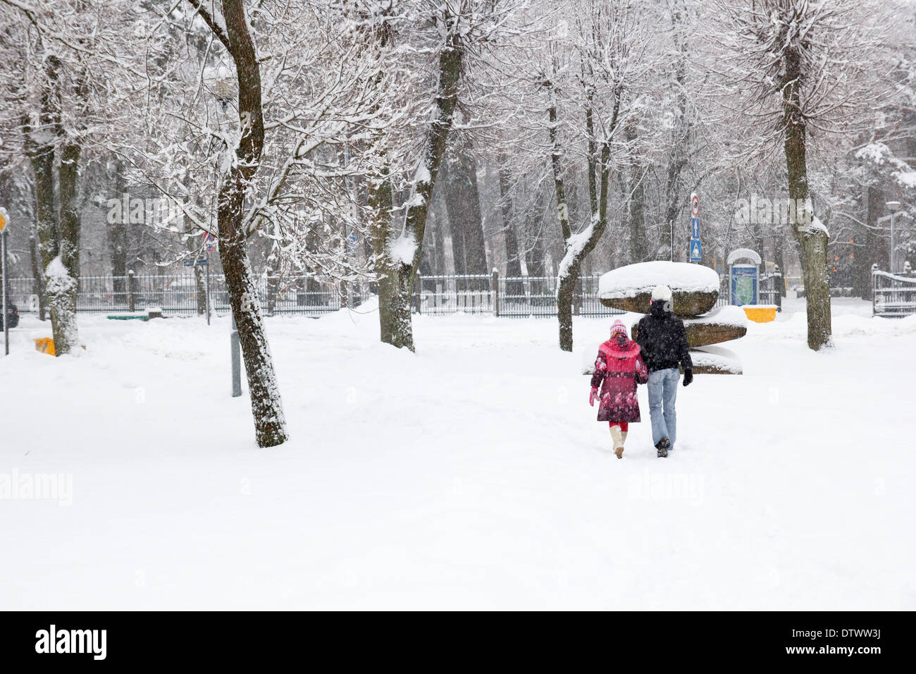 Girl walking in snow storm hi-res stock photography and images - Alamy