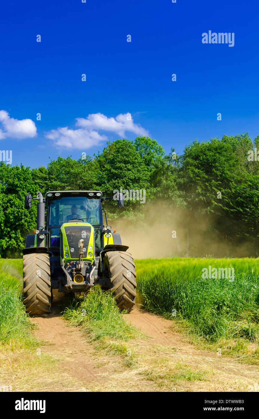 Tractor with baler Stock Photo - Alamy