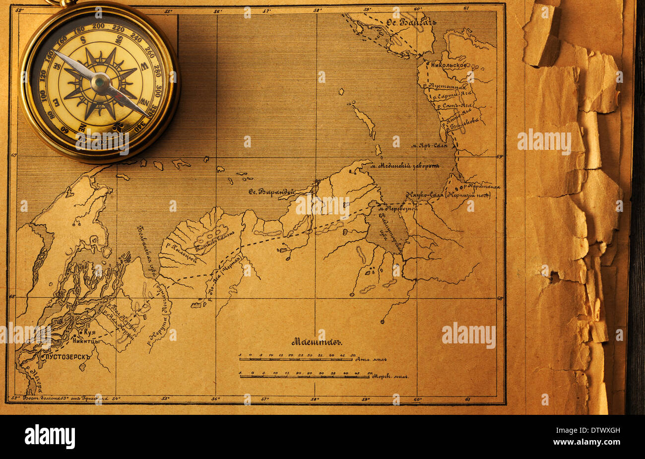 Antique compass over old map Stock Photo - Alamy
