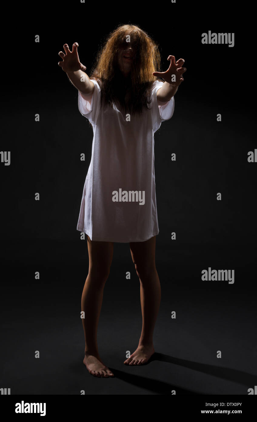 Zombie girl on black background Stock Photo - Alamy