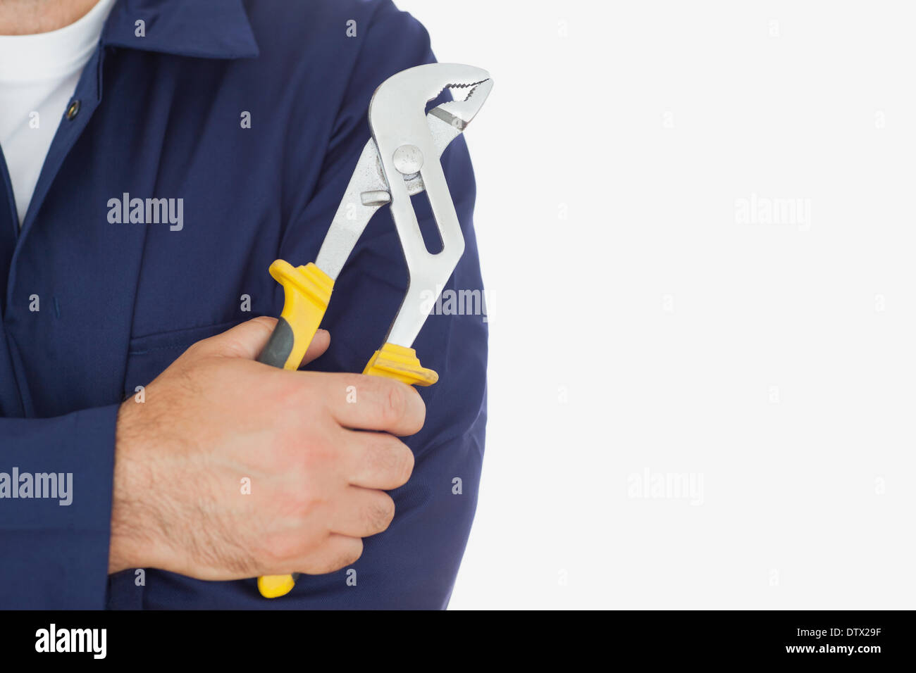 Mechanic holding pliers Stock Photo - Alamy