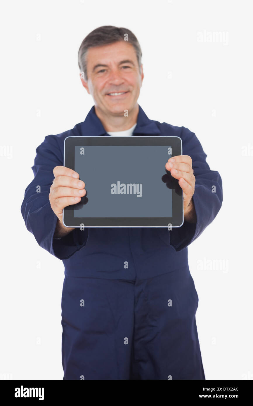 Mature mechanic holding digital hi-res stock photography and images - Alamy