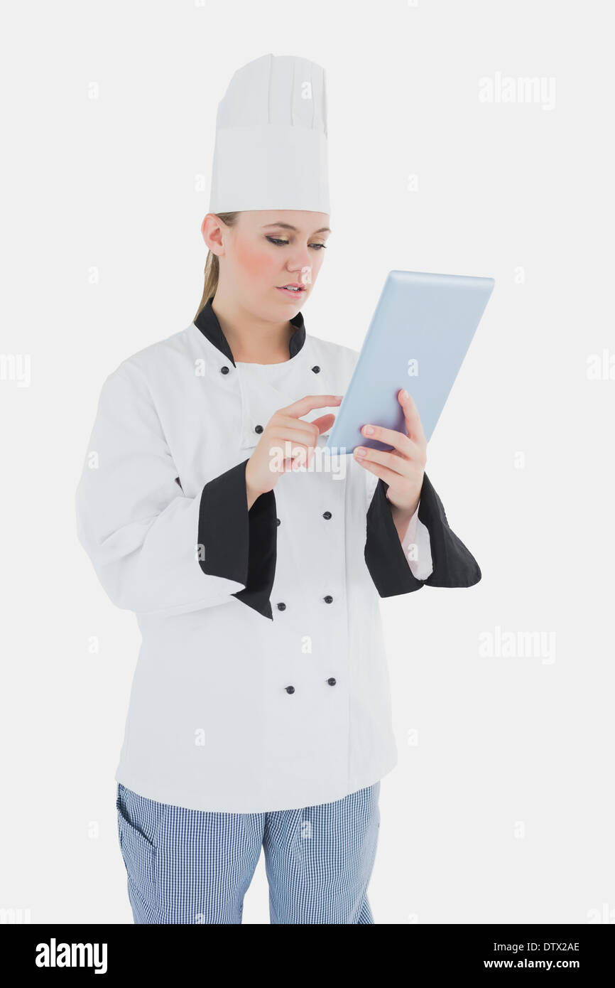 Chef using tablet pc Stock Photo - Alamy