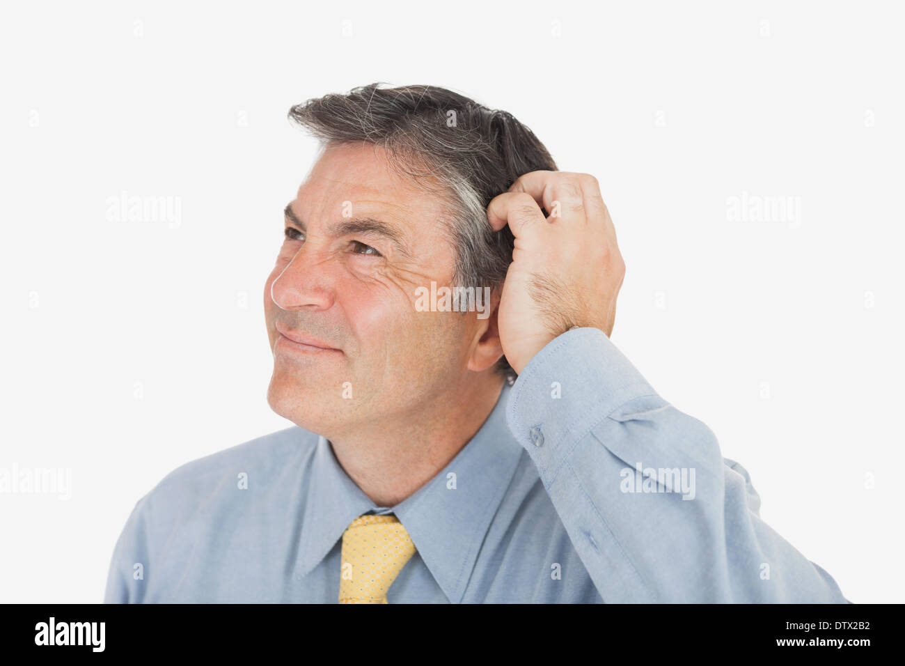 Businessman scratching head Stock Photo - Alamy