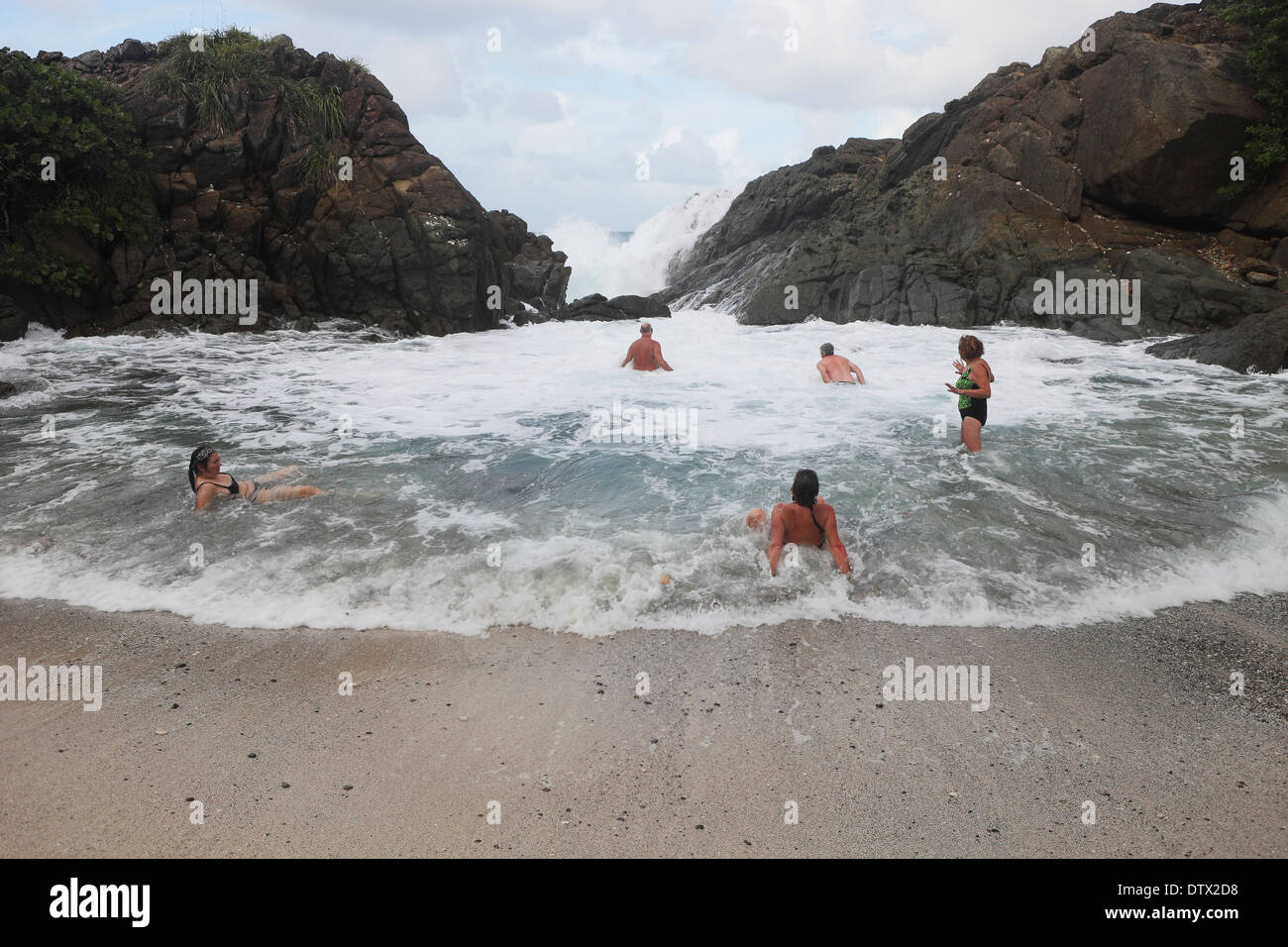 The Caribbean tide is forced in between rocks to create a bubbling pool ...