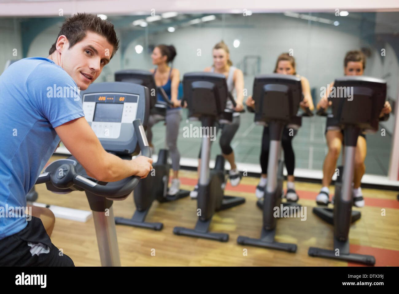 Male instructor at spinning class Stock Photo - Alamy