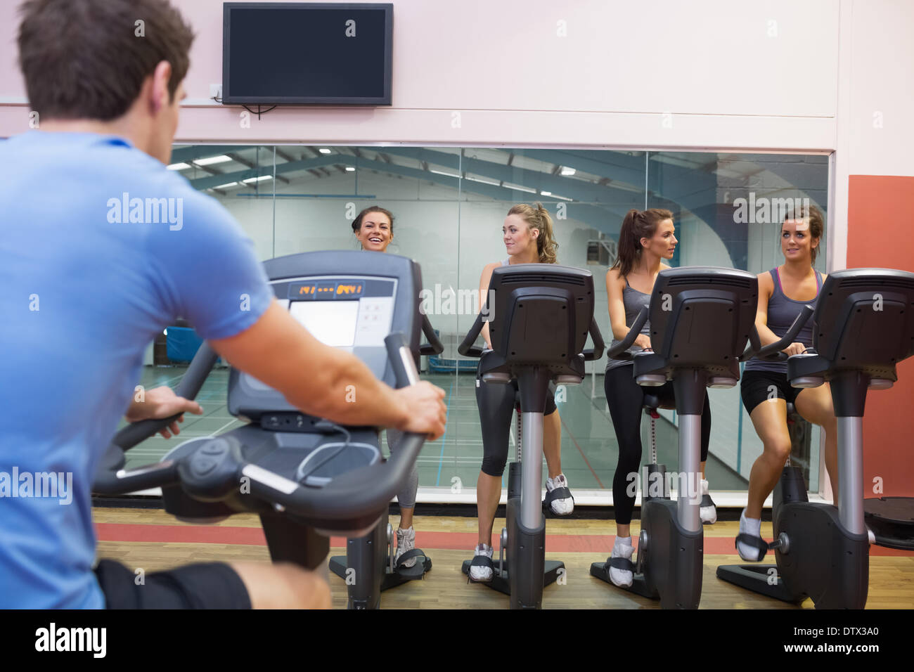 Happy women at spinning class Stock Photo - Alamy