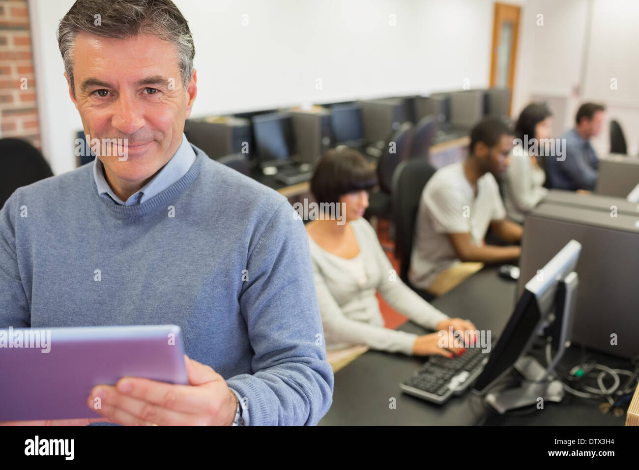 Hispanic female teacher holding hi-res stock photography and images - Alamy