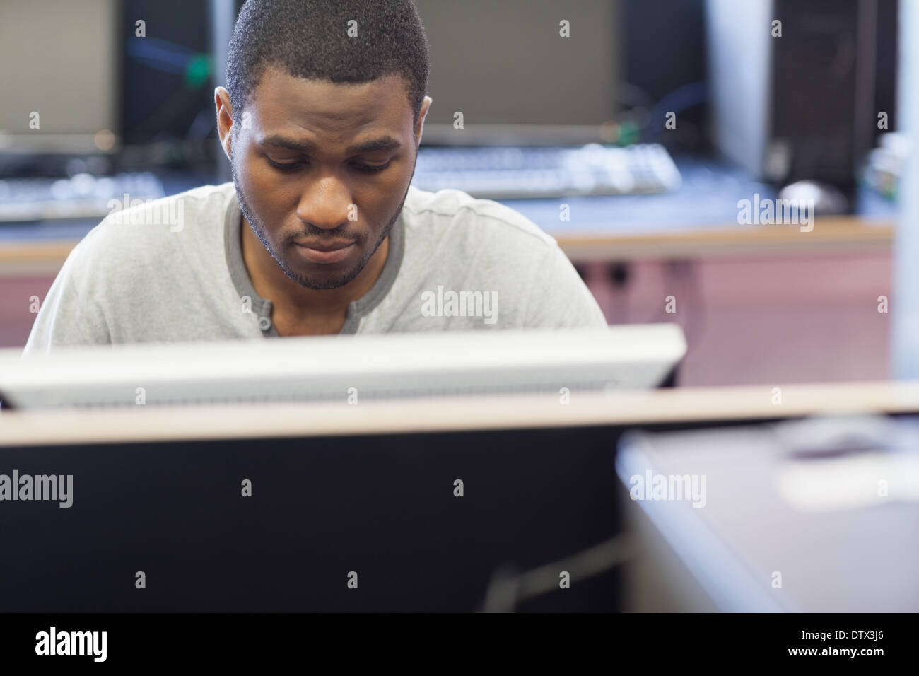 Student working in computer class Stock Photo - Alamy