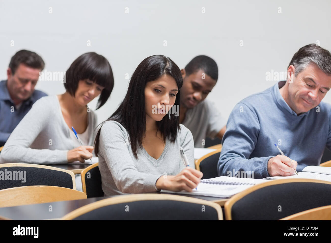 Students taking notes in lecture Stock Photo - Alamy