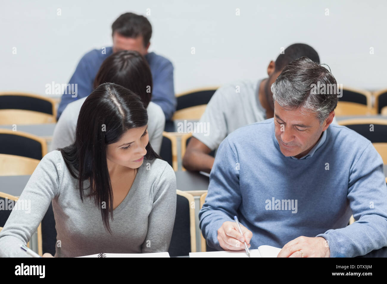 Man explaining to woman hi-res stock photography and images - Alamy